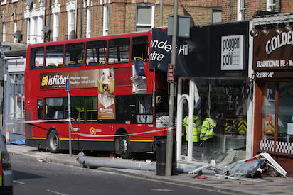Bus crashes into building, trapping two passengers - Vanguard News