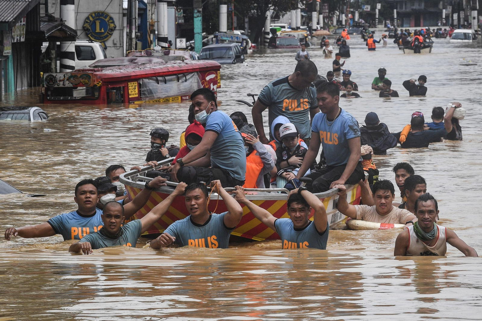 More than 60 dead as floods, landslide hit Philippines
