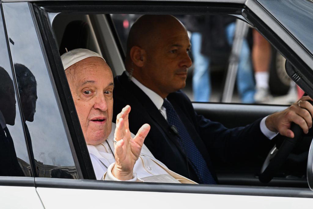'I am still alive', Pope Francis says after leaving hospital