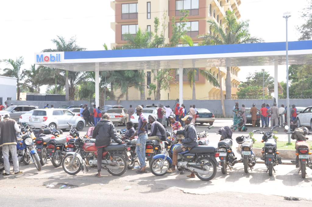 Photos: Passengers groan as fuel scarcity, long queues hit Lagos, Abuja, Kwara, Osun - Vanguard News